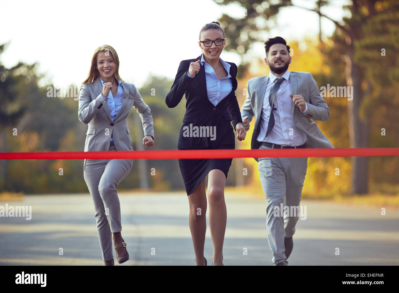 Three business opponents competing in cross Stock Photo - Alamy