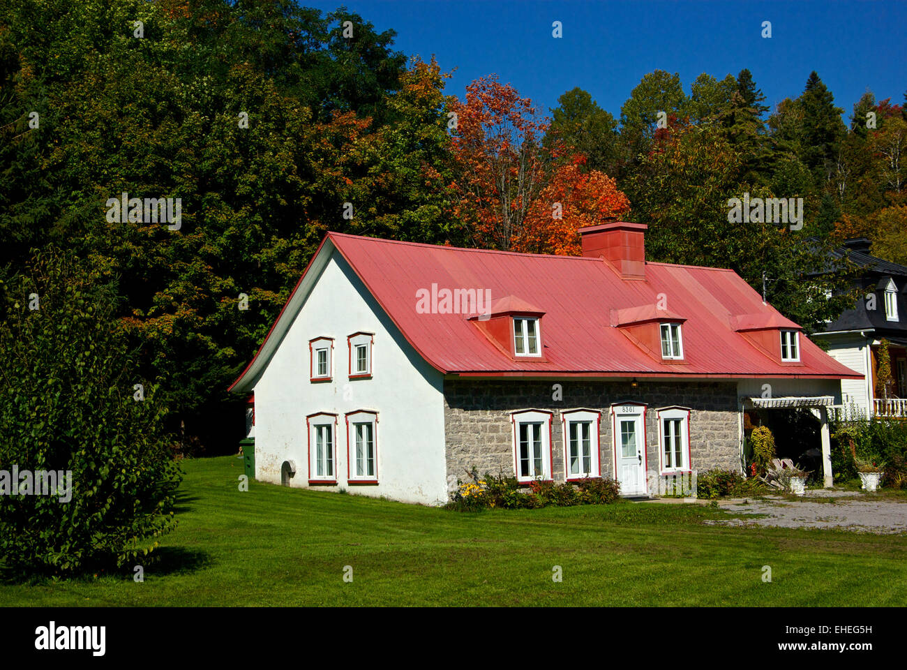 Old Quebec red ski jump roof plaster over stone farm house Chateau ...