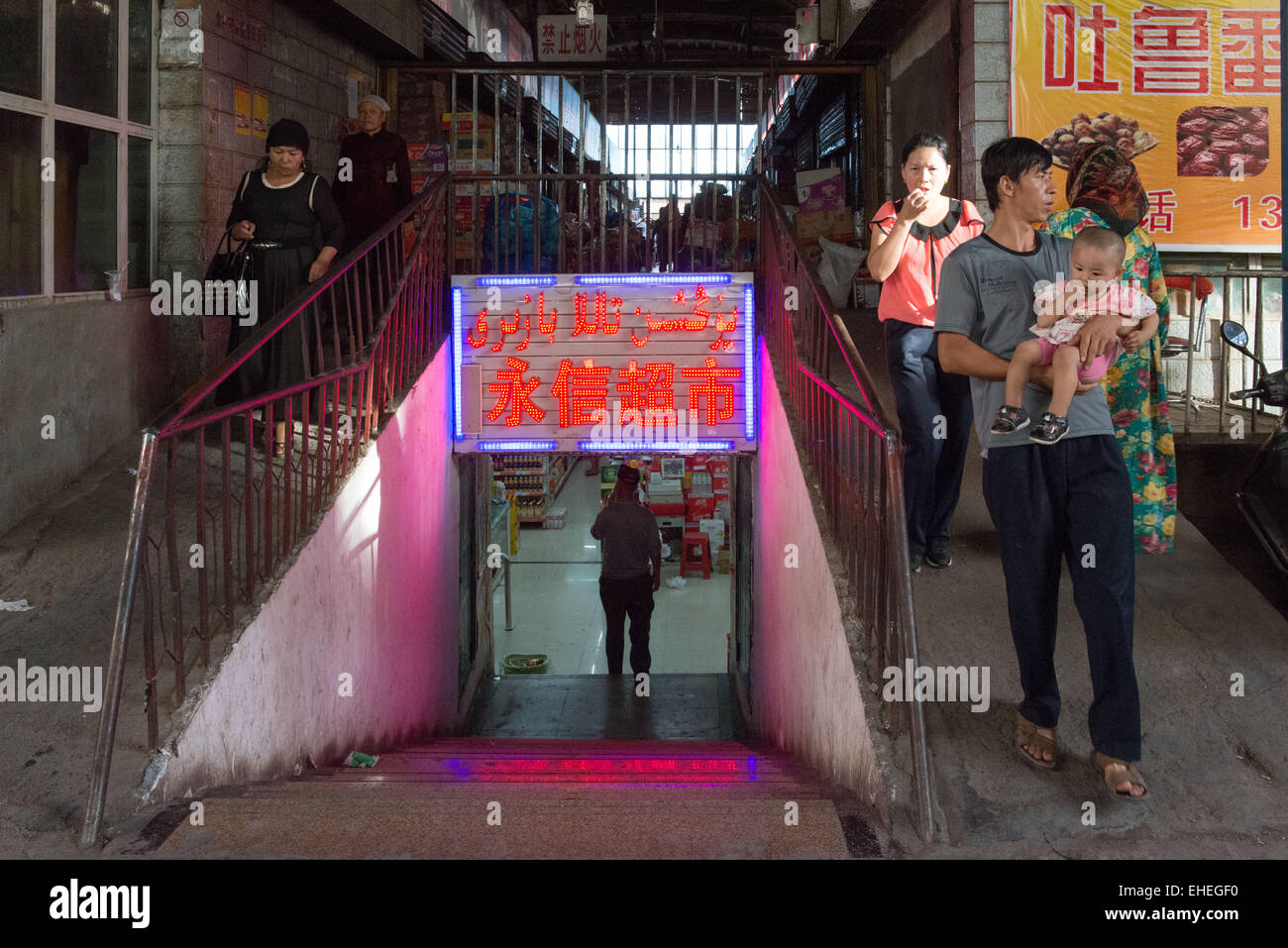 Family And Neon Sign, Turpan, Bazaar Stock Photo - Alamy