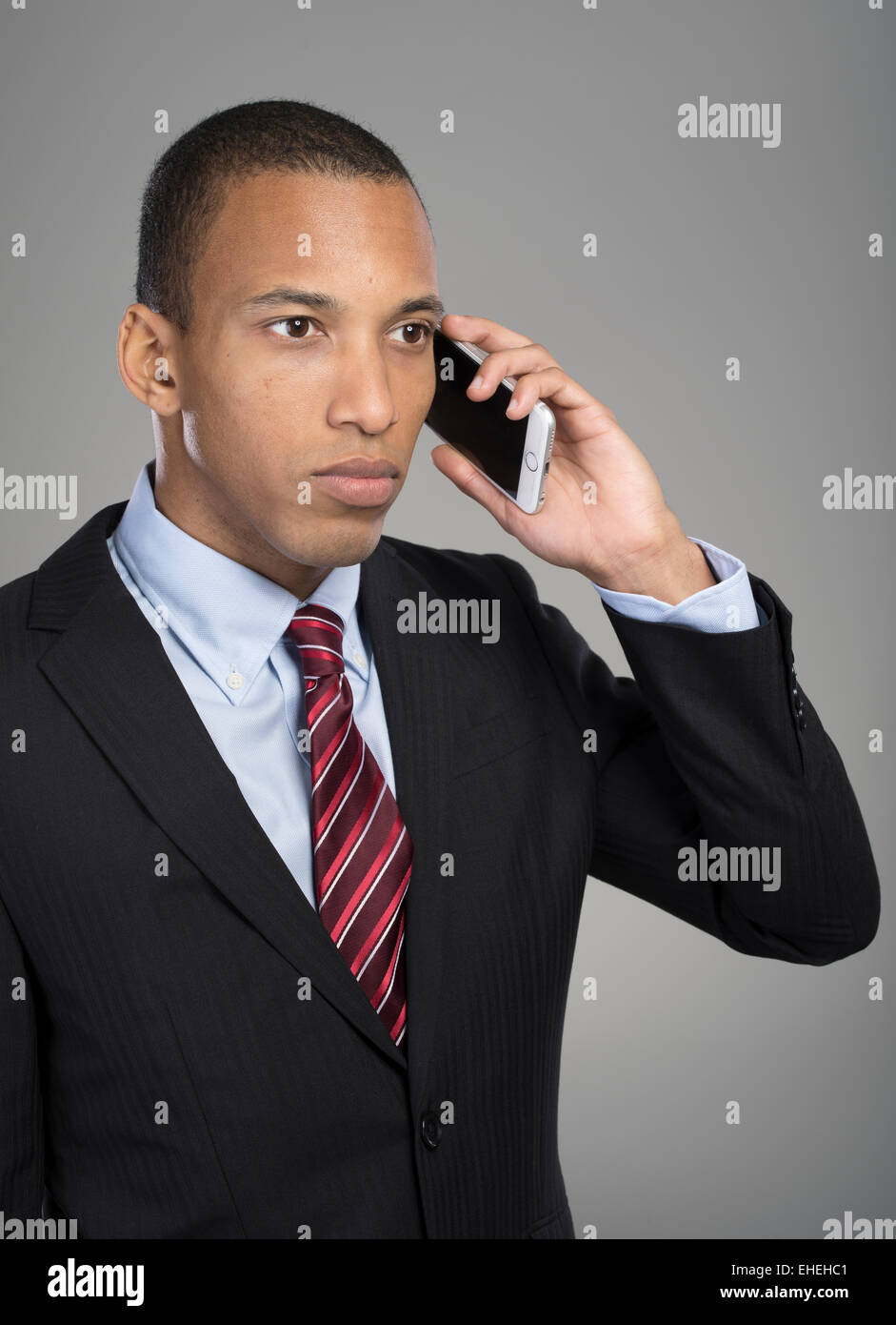 Businessman using Apple iphone Stock Photo - Alamy
