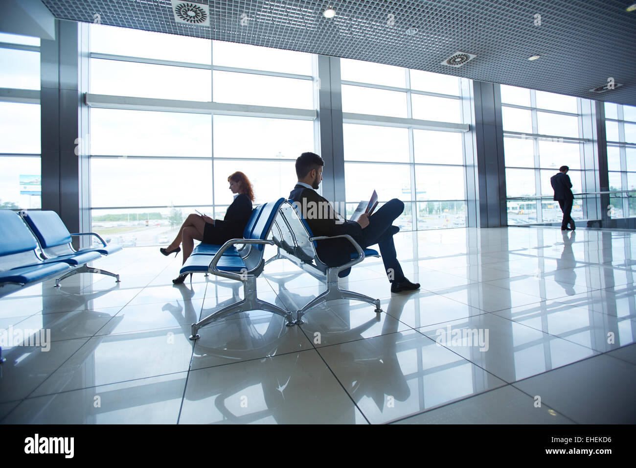 Woman waiting in station hall hi-res stock photography and images - Alamy