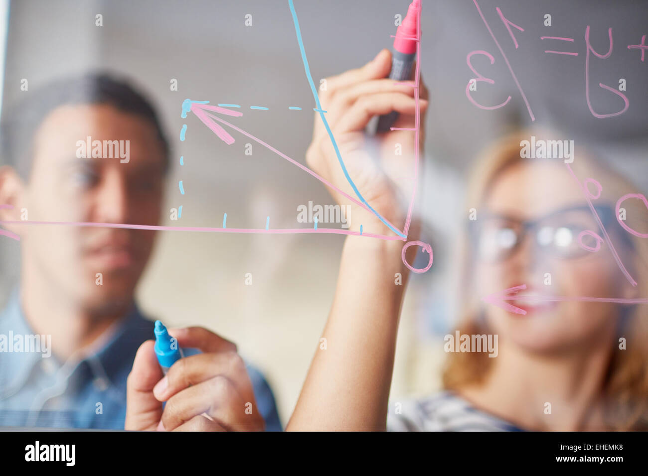 Students drawing graphs and formulas Stock Photo - Alamy
