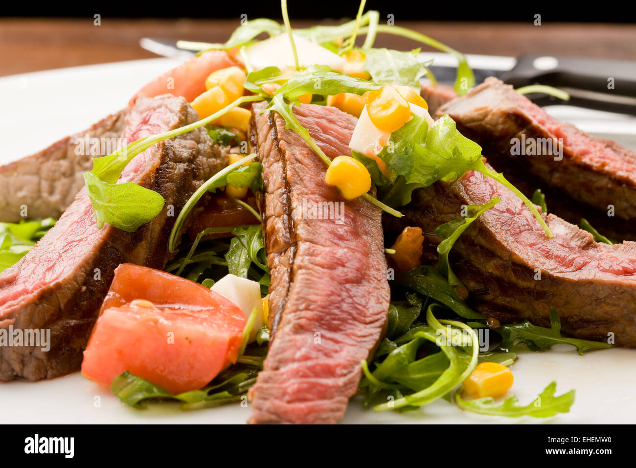 Meat with Rocket salad Stock Photo - Alamy