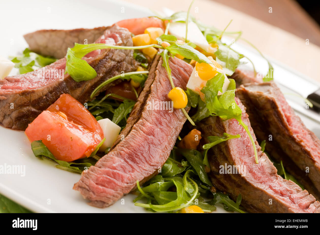 Meat with Rocket salad Stock Photo - Alamy