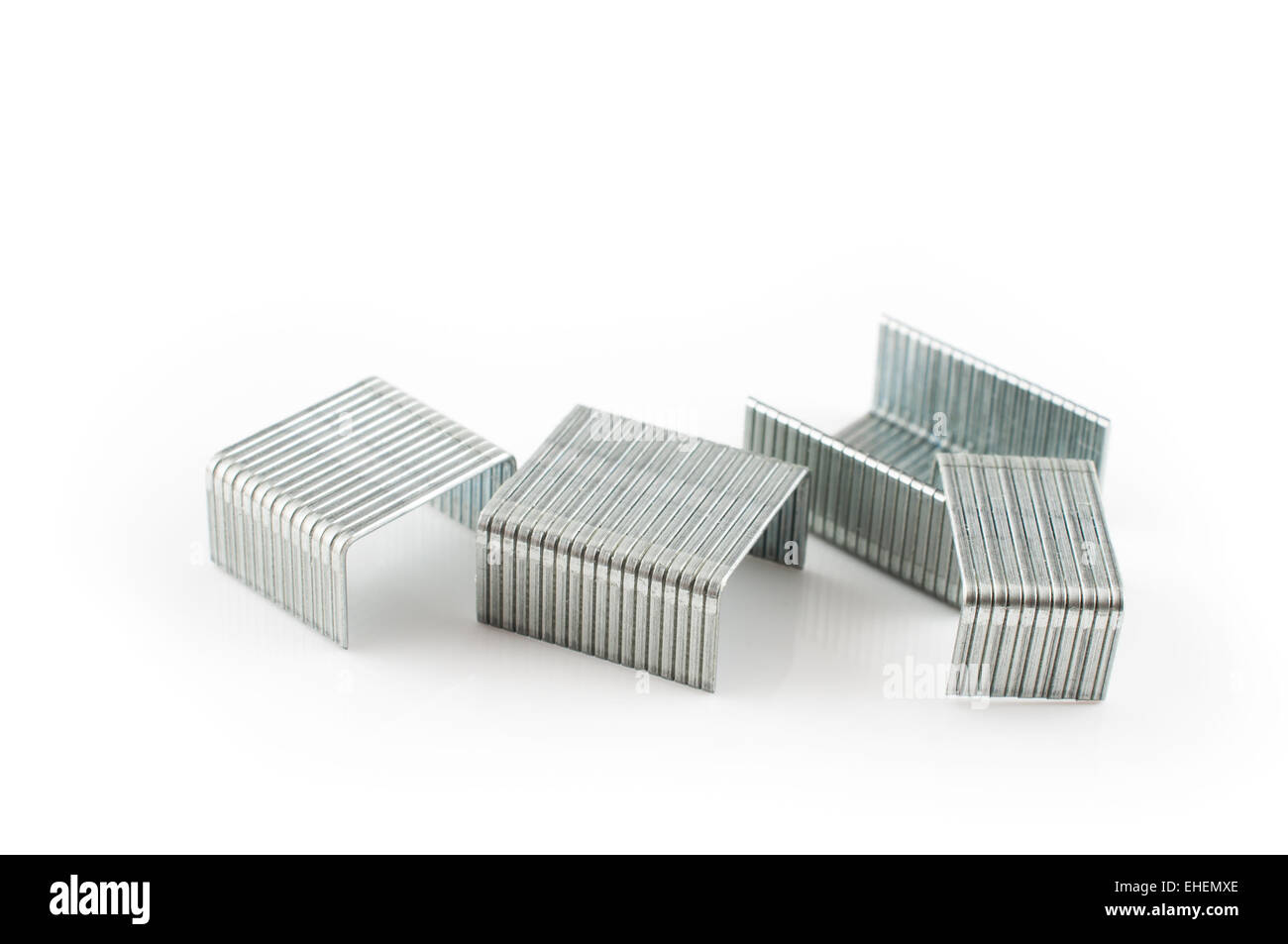 Staples stapler placed irregularly in white background Stock Photo - Alamy
