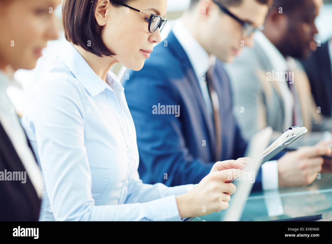 Row of people at meeting Stock Photo - Alamy
