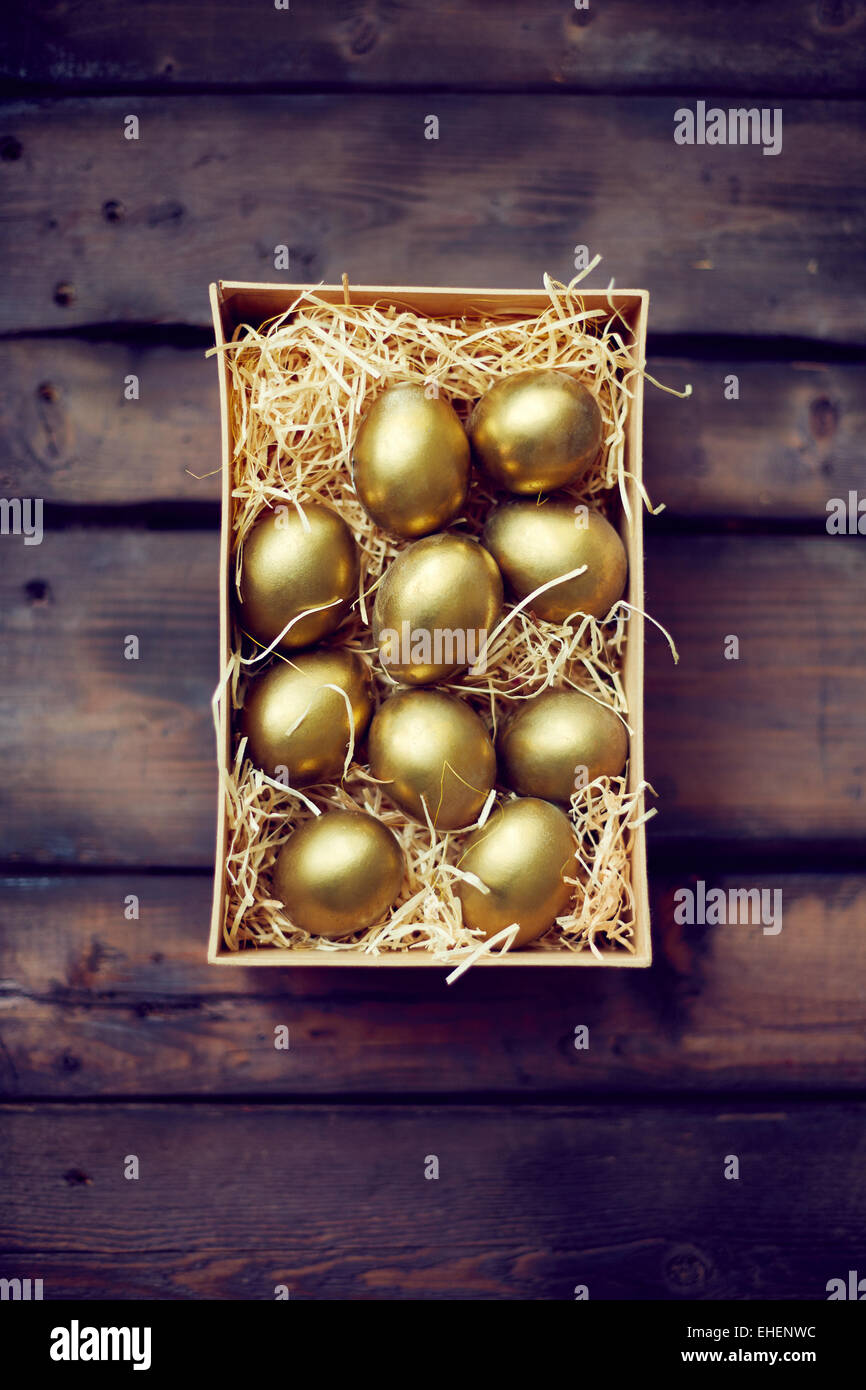 Box with painted golden eggs Stock Photo - Alamy