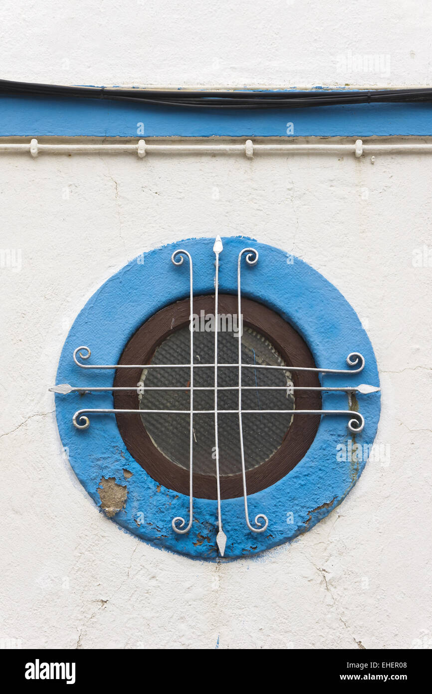 Round window with a grid Stock Photo - Alamy