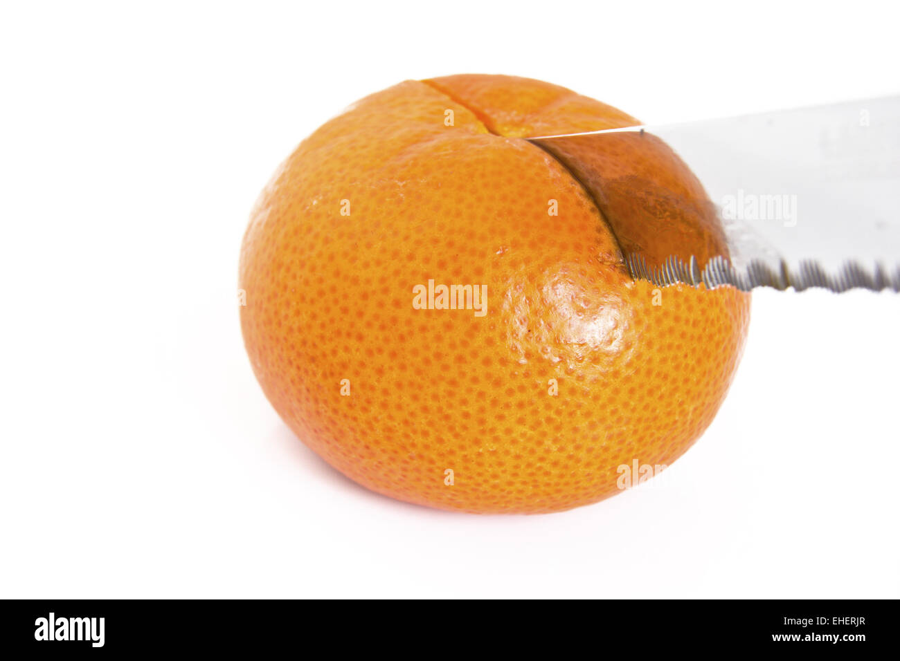 Mandarin orange cut with a knife Stock Photo - Alamy