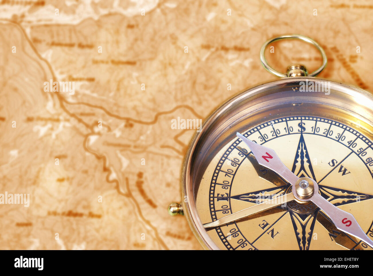 Compass on old map Stock Photo - Alamy