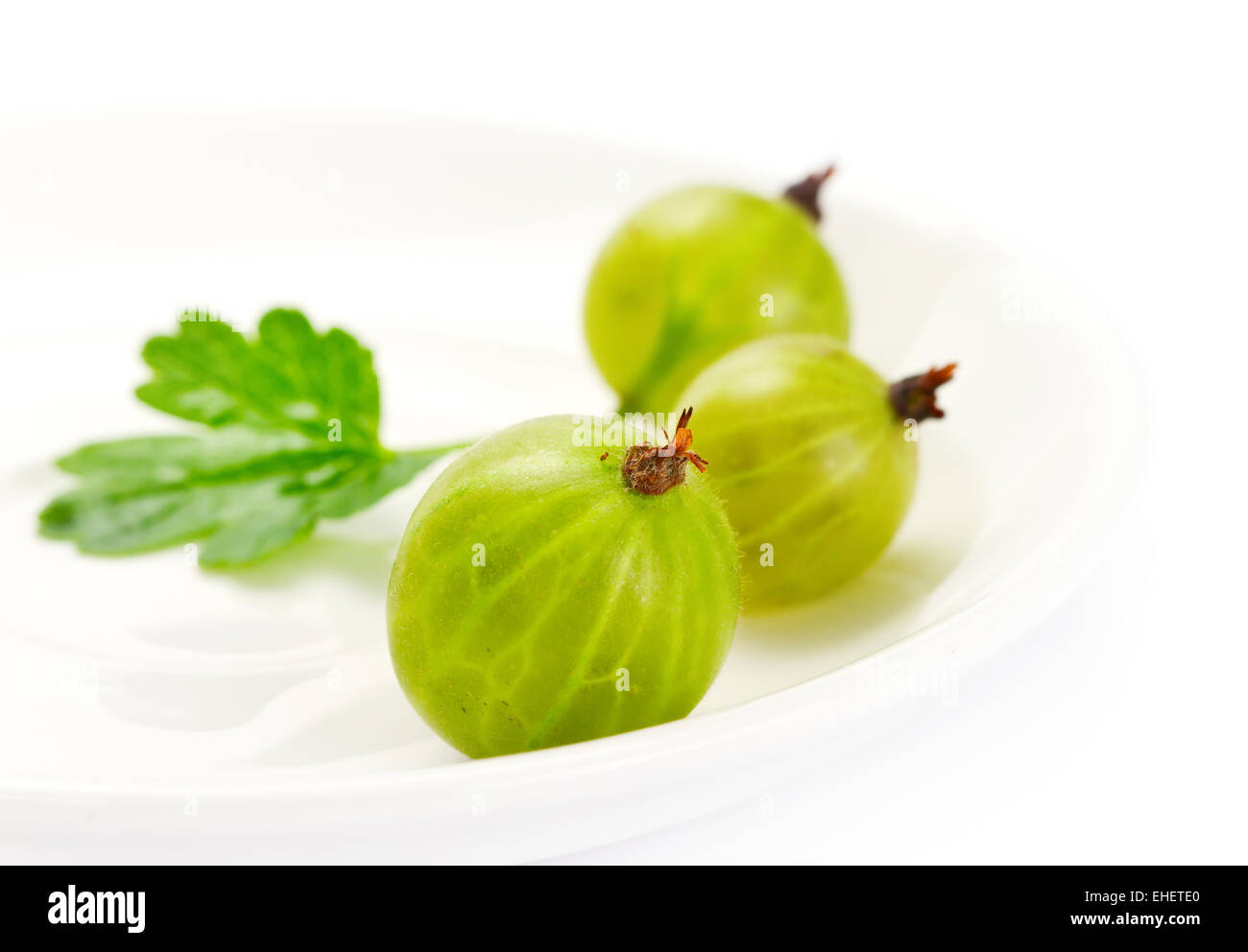 Gooseberries isolated on white background Stock Photo - Alamy