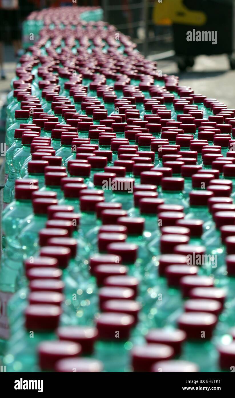 a row of bottles filled with water Stock Photo - Alamy