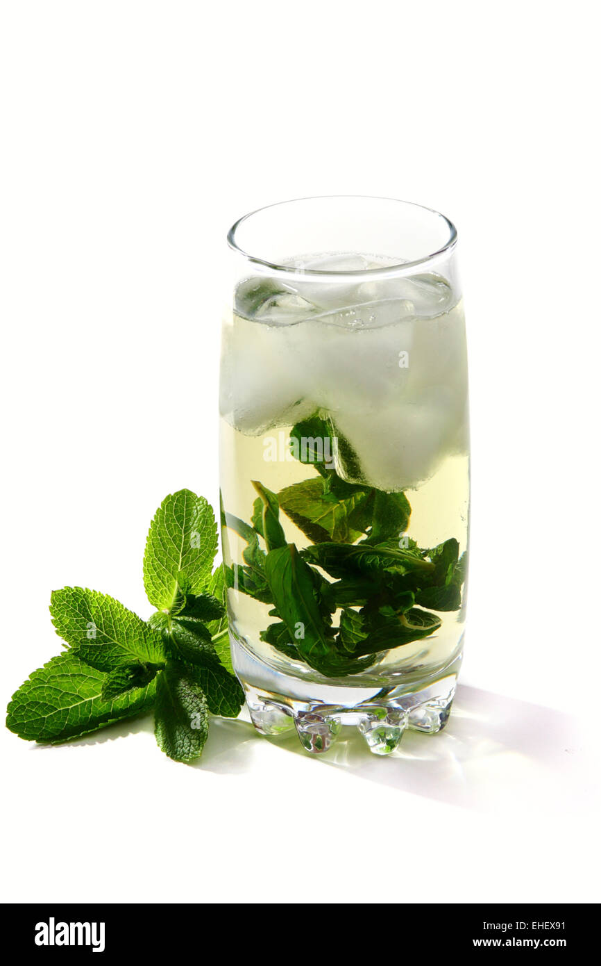 Mint iced tea on a white background Stock Photo - Alamy