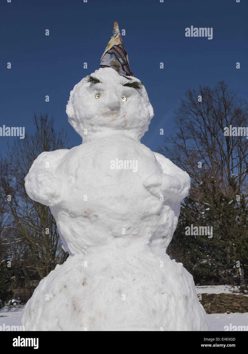 Snowman in front of blue sky Stock Photo - Alamy