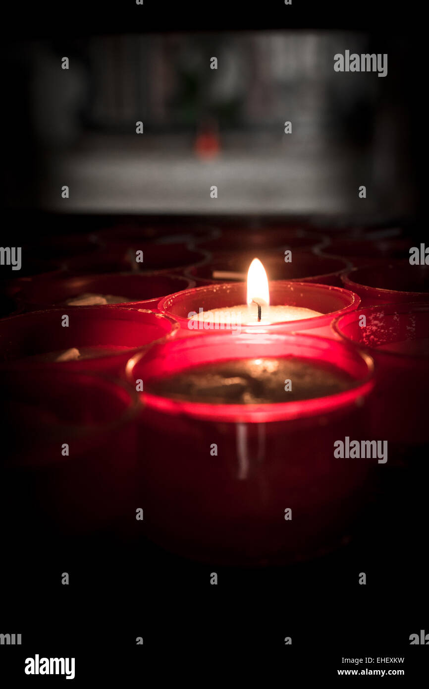 Group of red candles in a church Stock Photo - Alamy