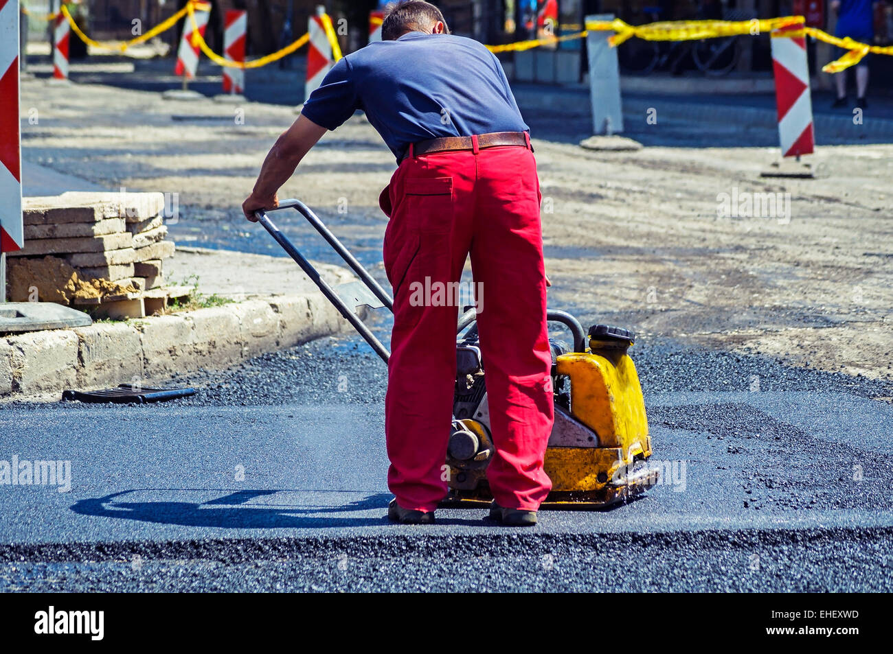 Man is working at the road construction Stock Photo - Alamy