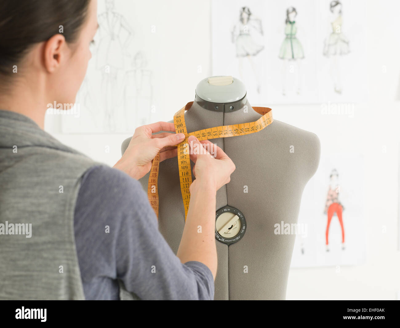 Fashion designer at work measuring tape hi-res stock photography and ...