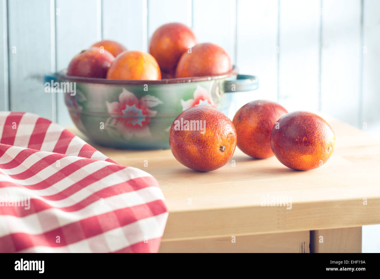 blood red oranges on kitchen table Stock Photo - Alamy