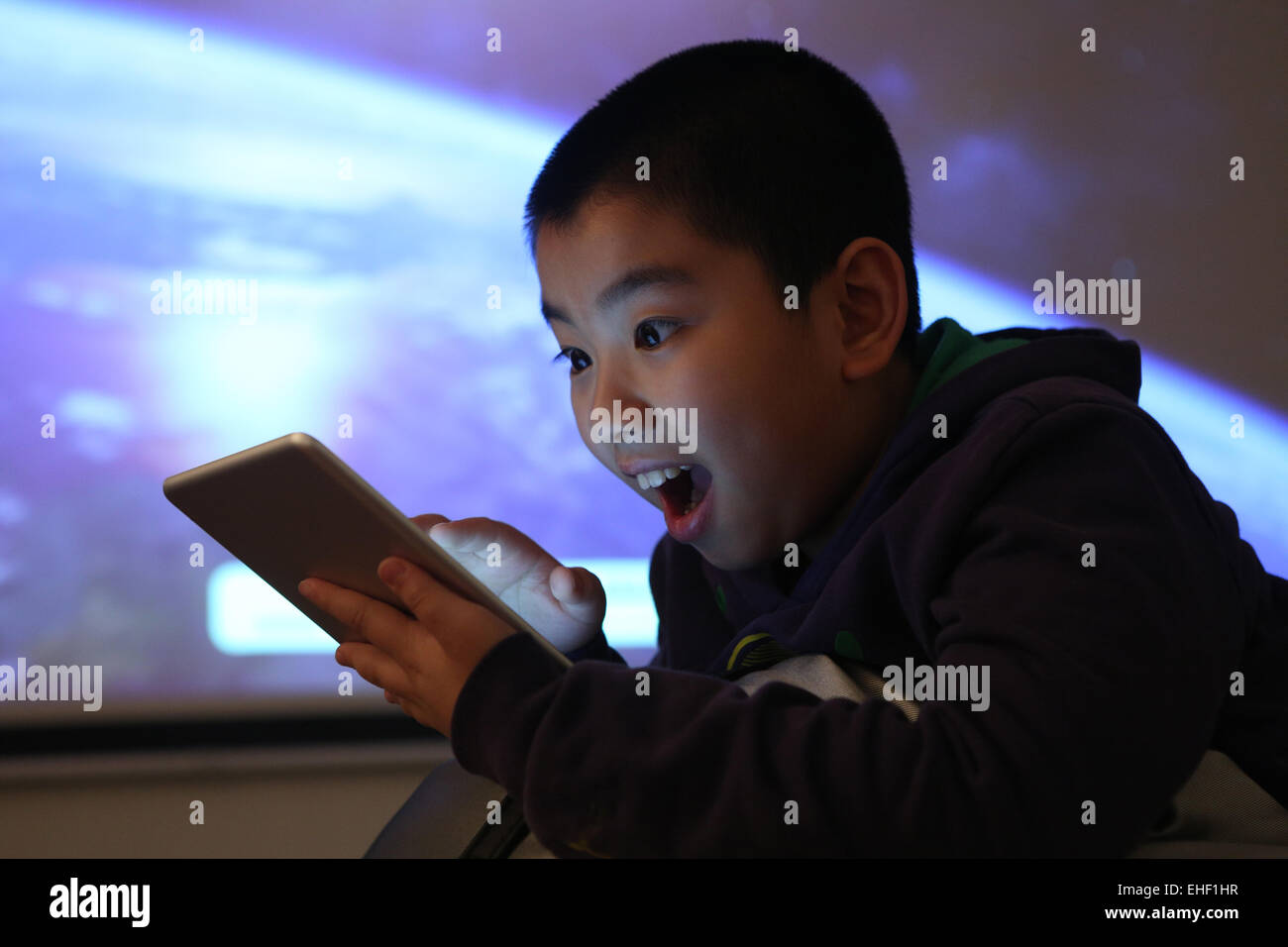 Boy watching monitor hi-res stock photography and images - Alamy