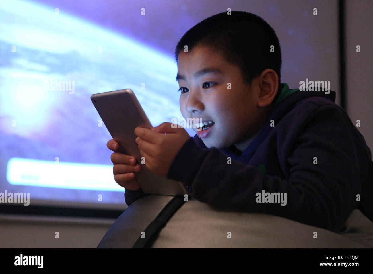 Boy touching tv screen hi-res stock photography and images - Alamy