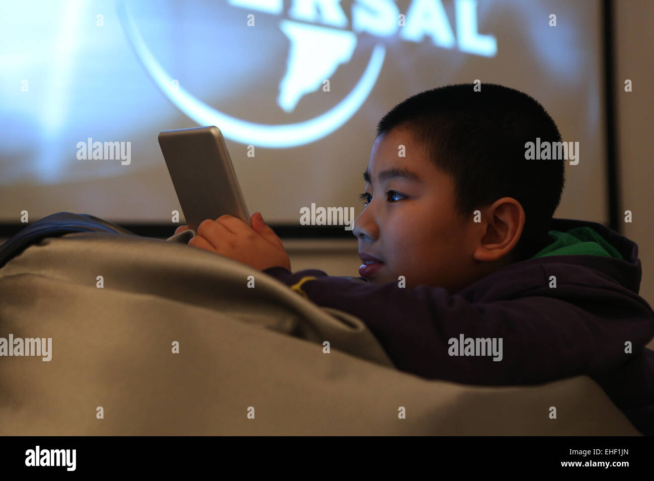 Boy touching tv screen hi-res stock photography and images - Alamy