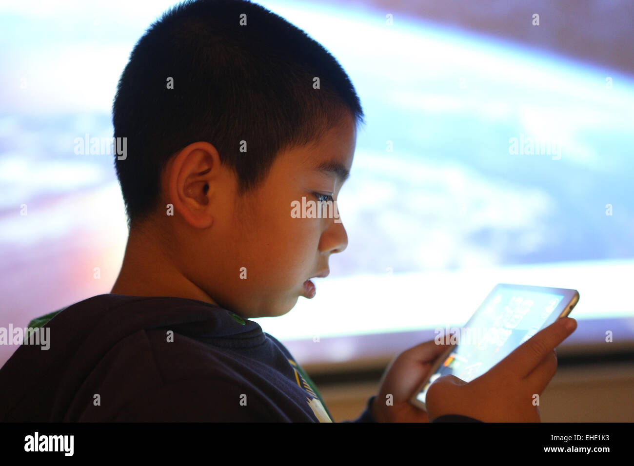 Boy touching tv screen hi-res stock photography and images - Alamy