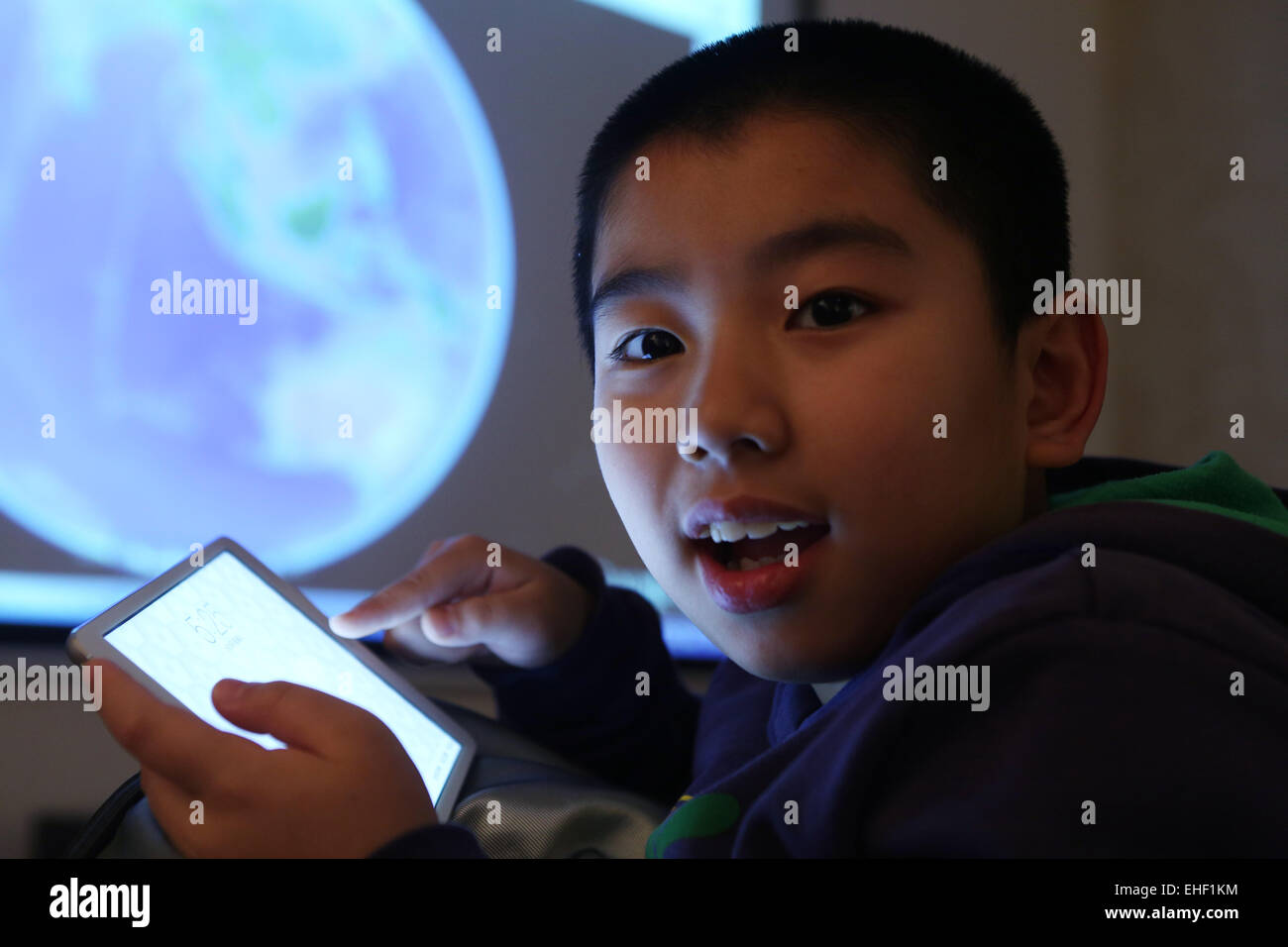 Boy touching tv screen hi-res stock photography and images - Alamy