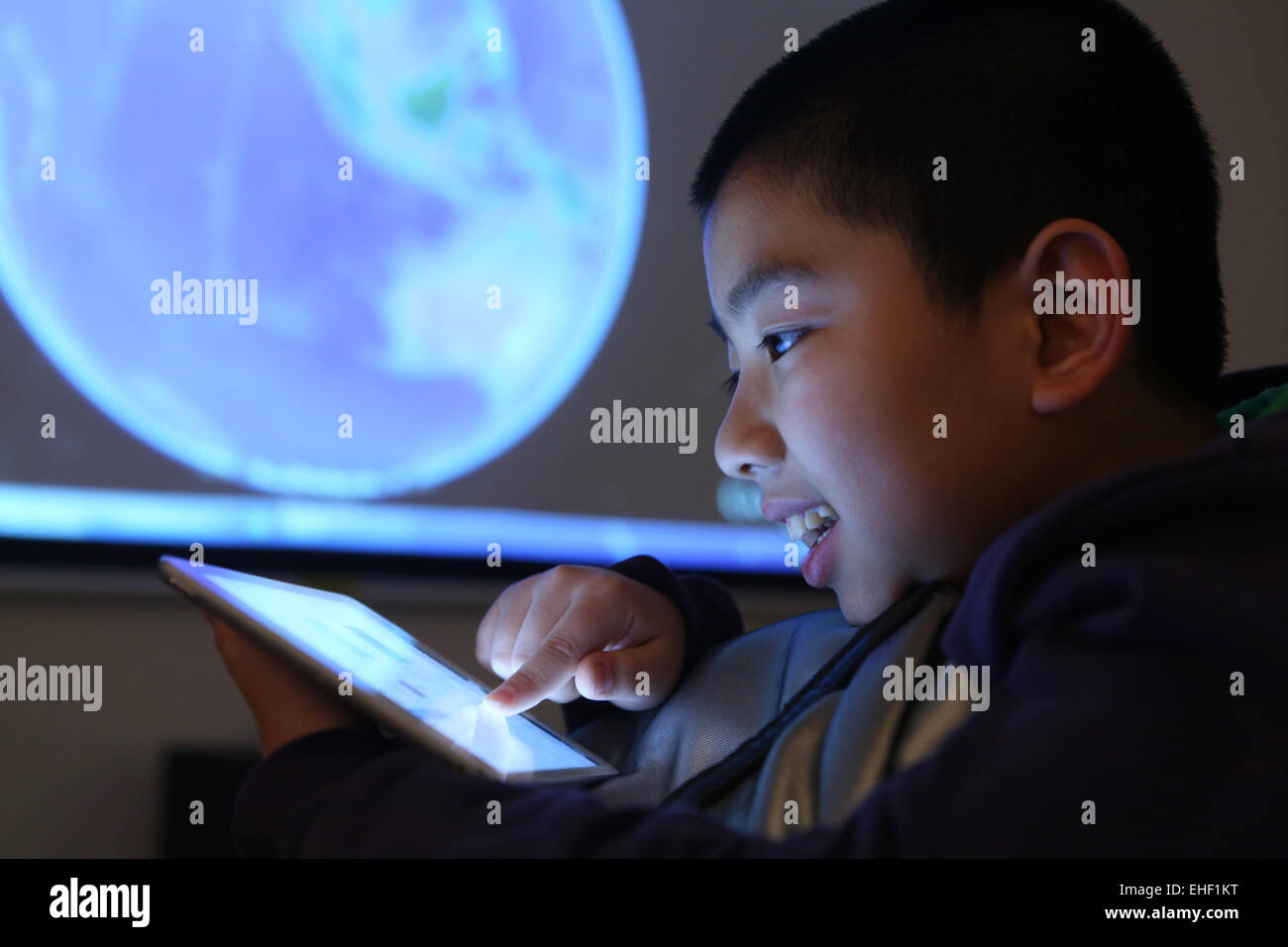 Boy touching tv screen hi-res stock photography and images - Alamy