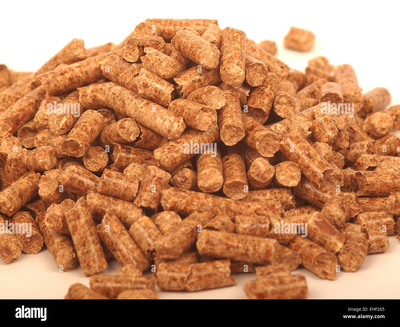 closeup image of wood pellets on white background Stock Photo - Alamy
