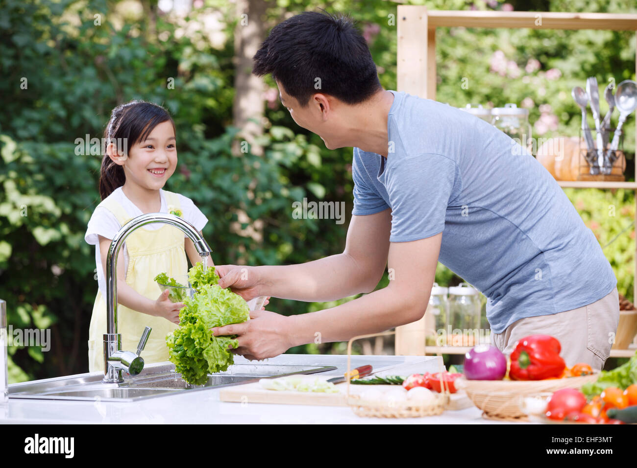 Father and daughter to prepare ingredients in the outdoor kitchen Stock ...