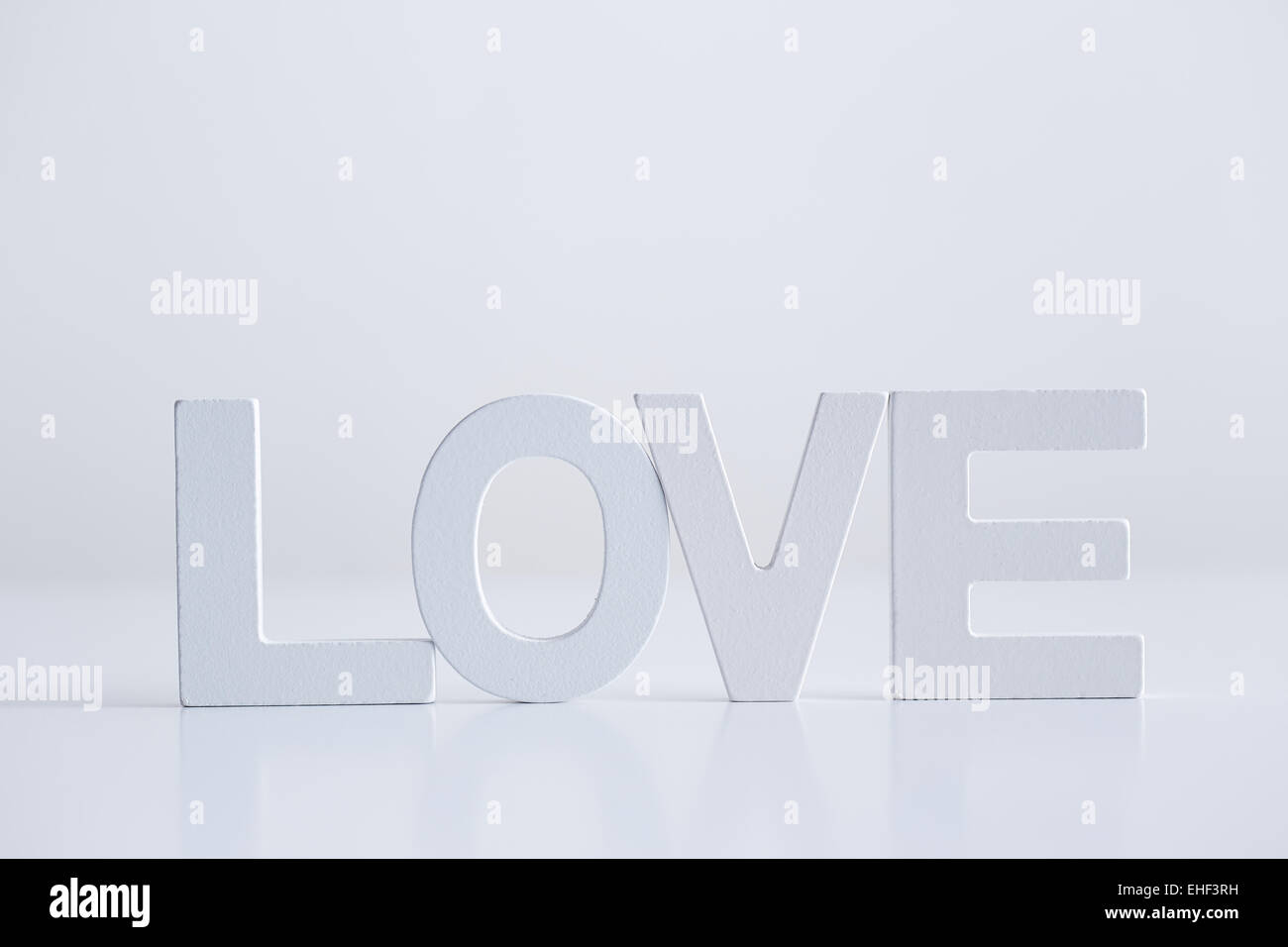 Love word written in white letters on white background Stock Photo - Alamy