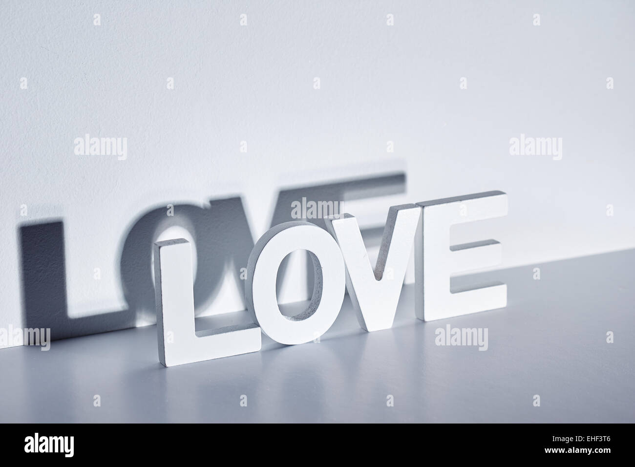 Love word written in white letters on white background Stock Photo - Alamy