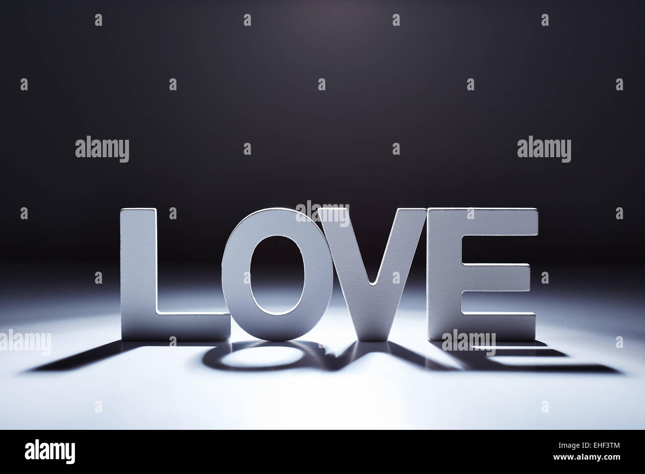 Love word written with a long shadow on white background Stock Photo ...
