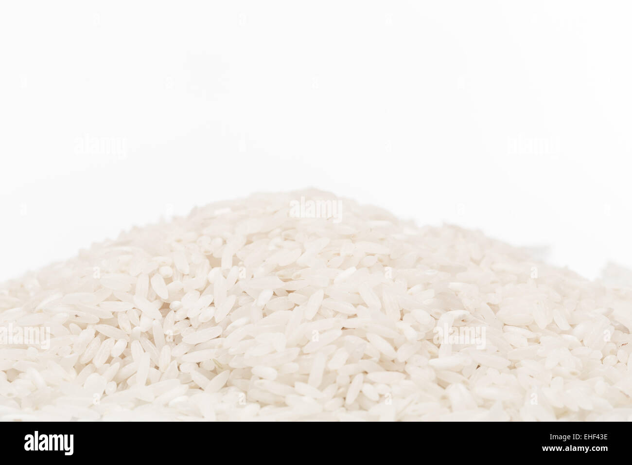 Asian white rice or uncooked white rice Stock Photo - Alamy