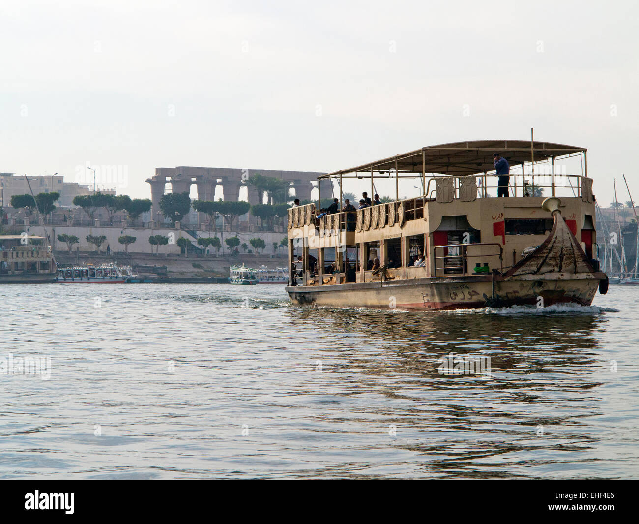 the local ferry crossing the Nile departing from landing stage in front ...
