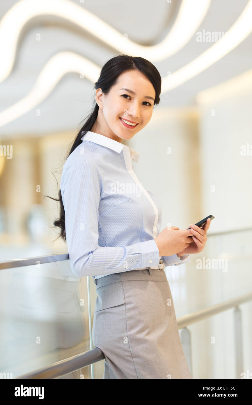 Successful business women are using mobile phones Stock Photo - Alamy