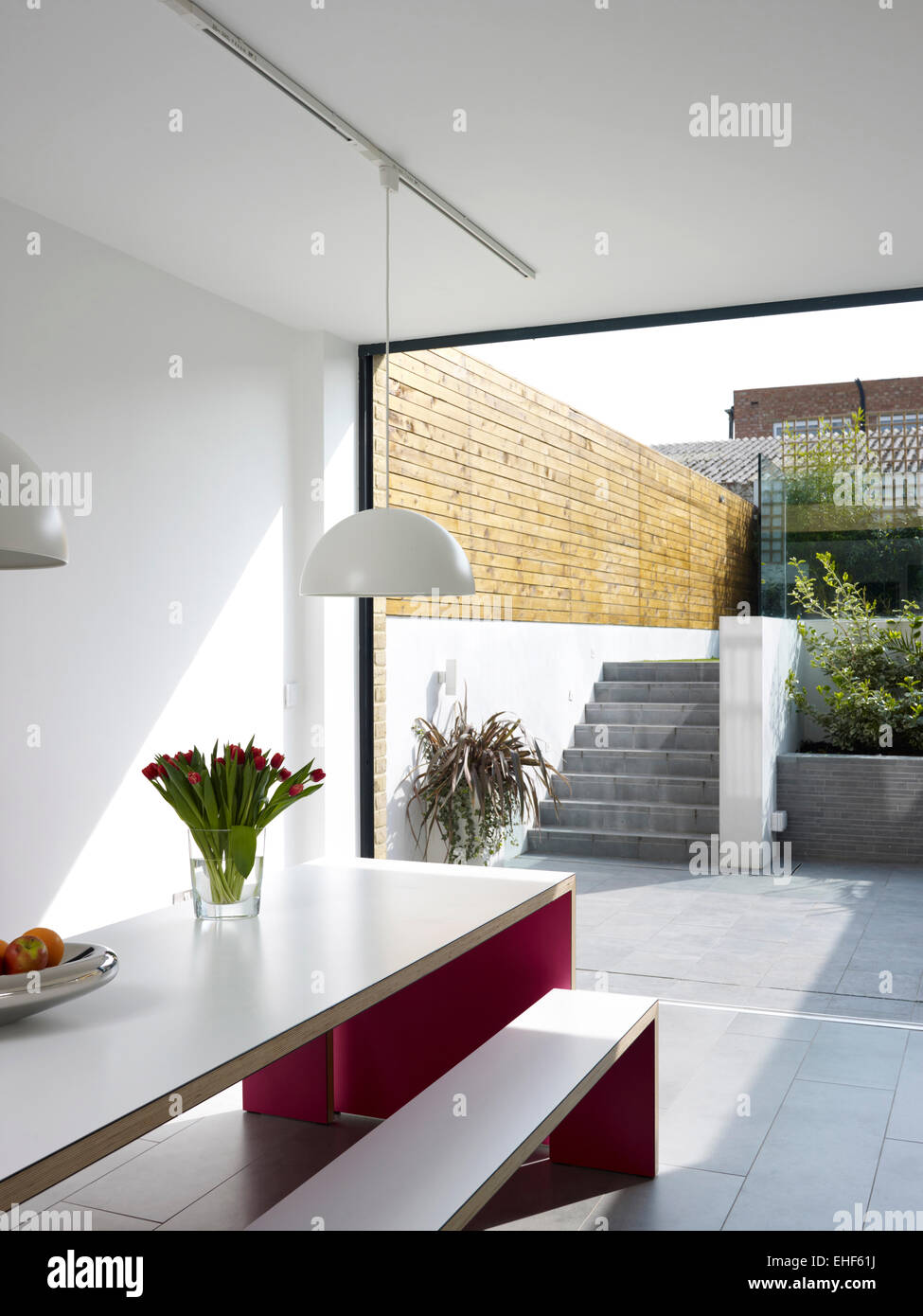 Daylight view through to courtyard from dining area in The Gap House ...
