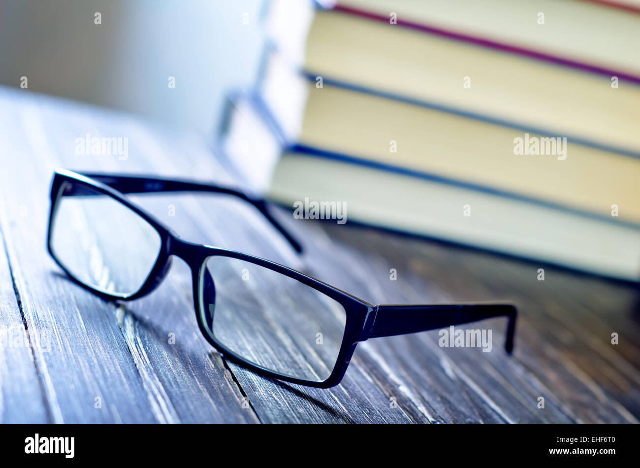 Black frame glasses books hi-res stock photography and images - Alamy