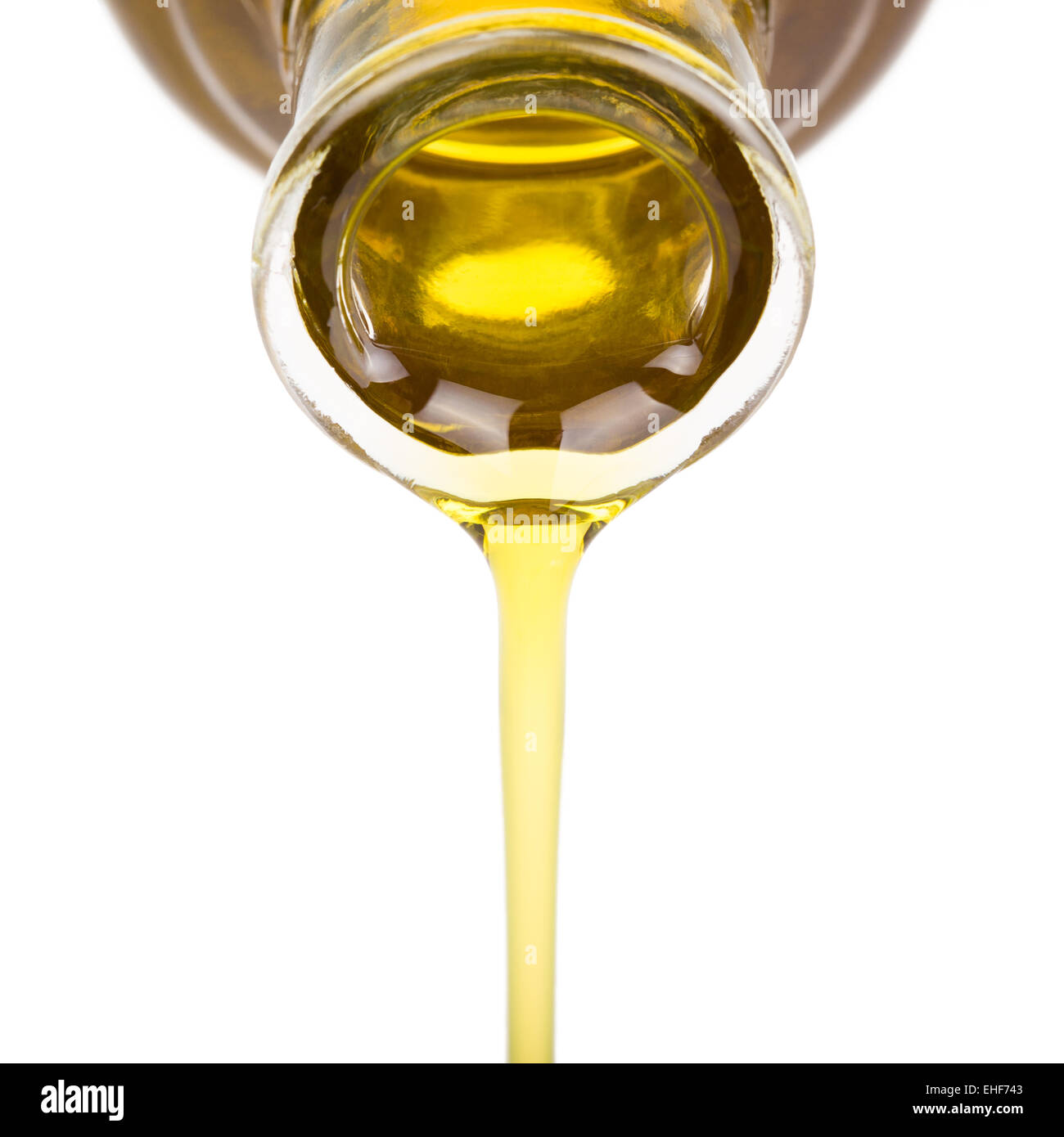 Oil pouring from a bottle Stock Photo - Alamy