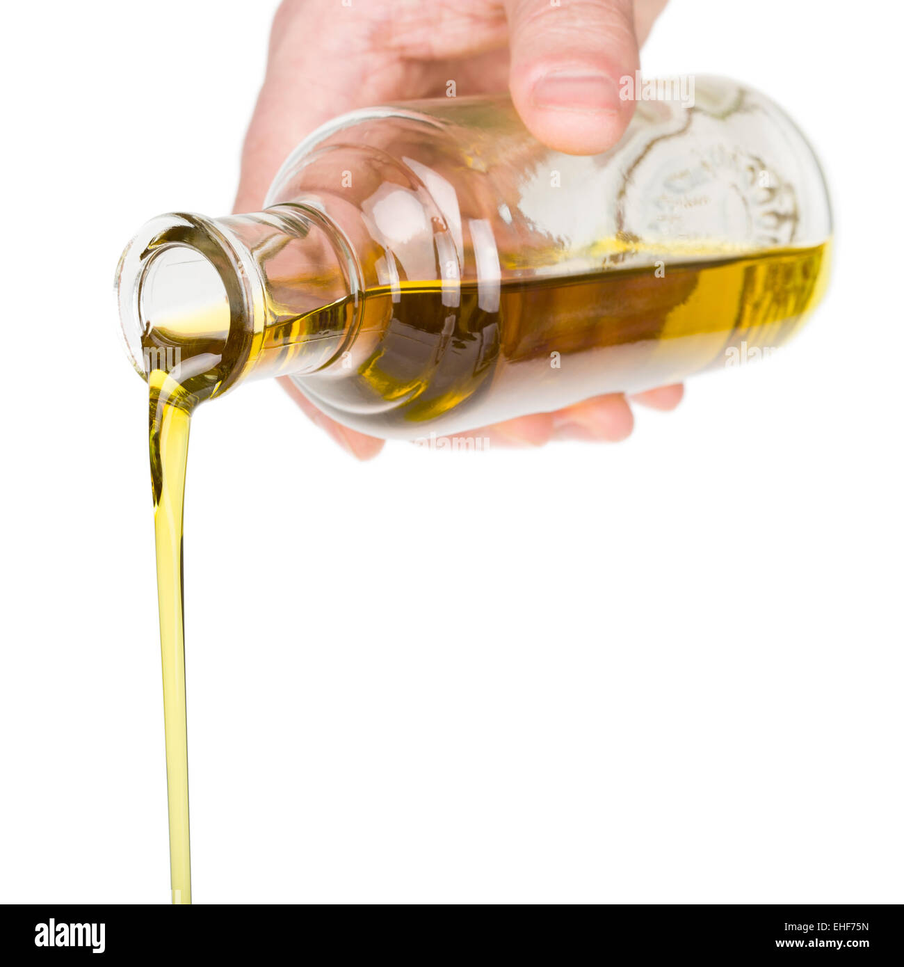 Oil pouring from a bottle Stock Photo - Alamy