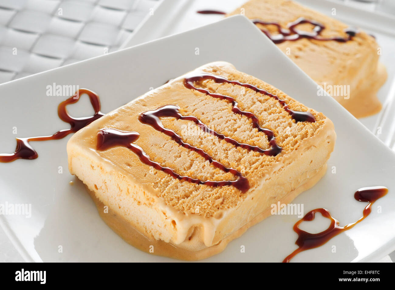 some plates with spanish turron ice cream served with syrup Stock Photo ...