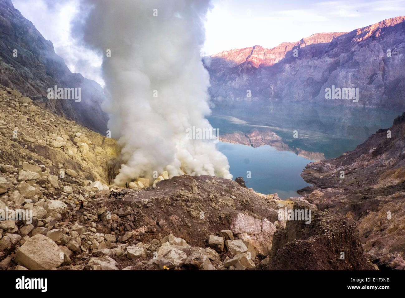 Tower of steam emerging in front of the lake, Ijen crater, Indonesia ...