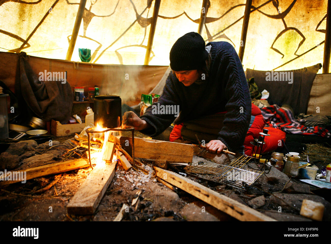 Making tea at Tipi Valley an eco community near Talley in Wales Stock ...