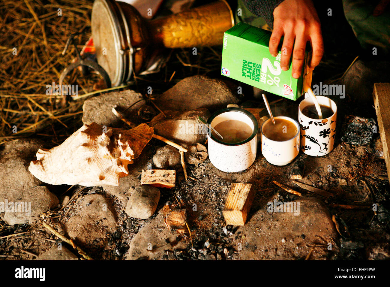 Making tea at Tipi Valley an eco community near Talley in Wales Stock ...