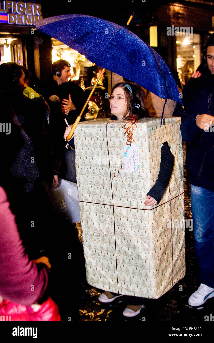 Girl dressed up in Christmas present fancy dress Stock Photo - Alamy