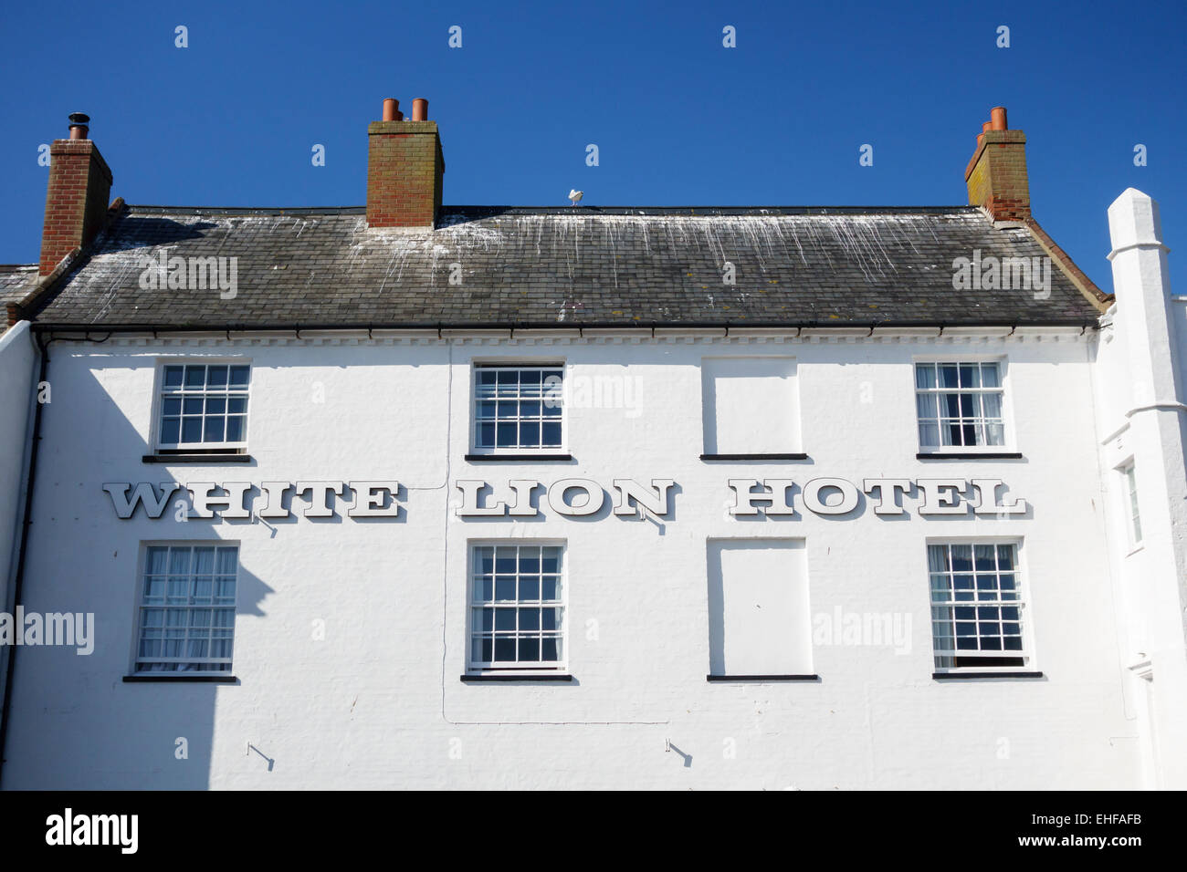 The facade of the White Lion Hotel on the sea front in Aldeburgh ...