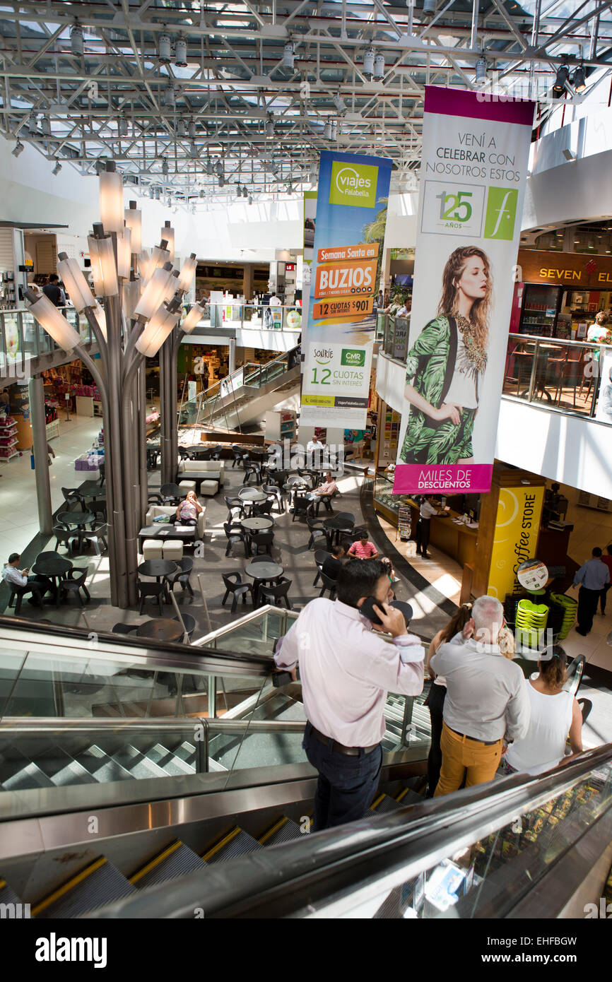 Argentina, Buenos Aires, Avenida Florida, shoppers on escalator inside ...