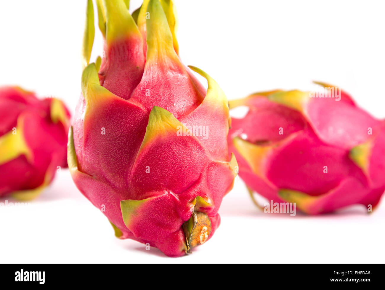 Close-up shot of exotic pink dragon fruits, selective focus on first ...