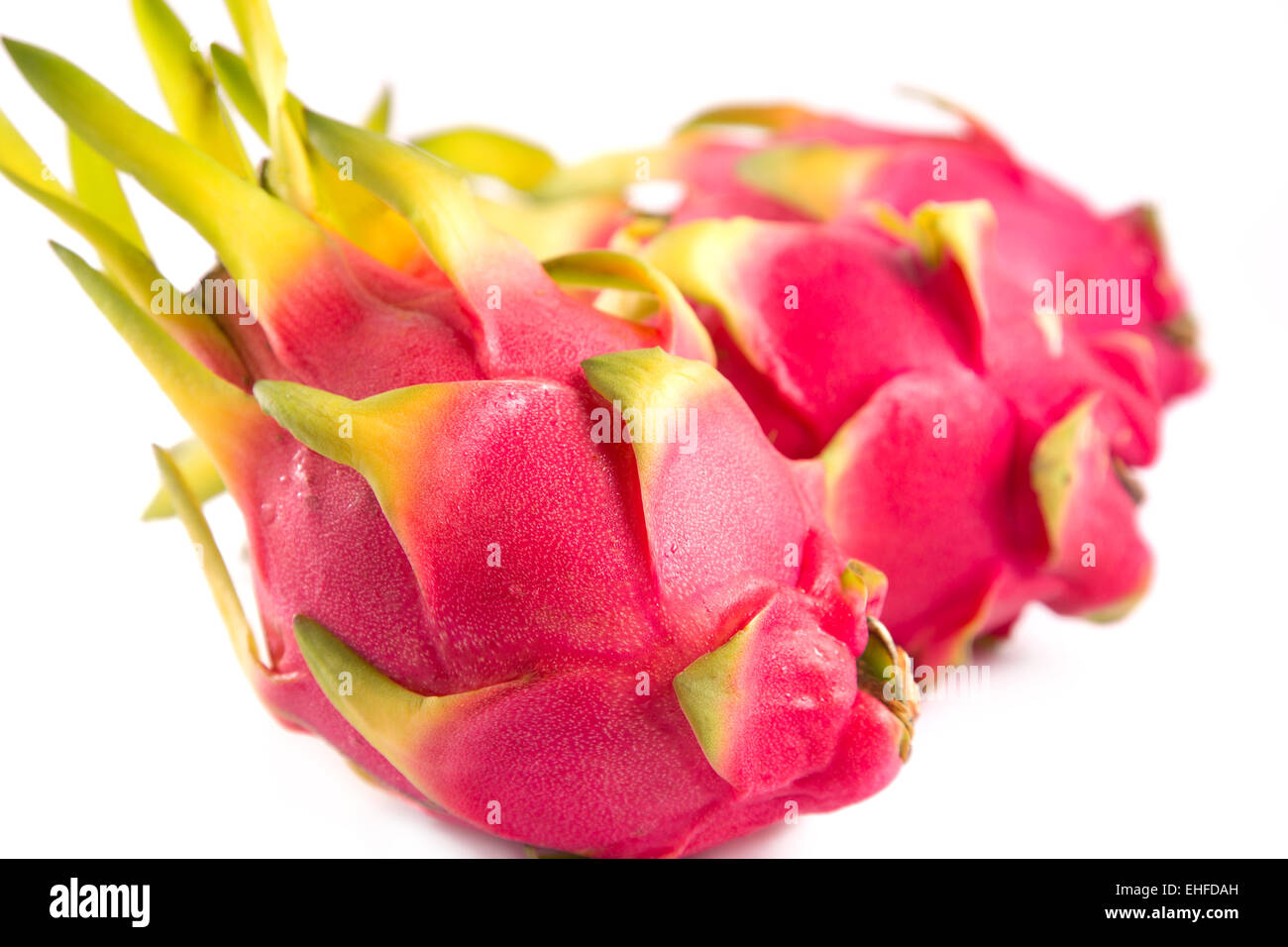 Three exotic dragon fruits, selective focus on first fruit, isolated on ...