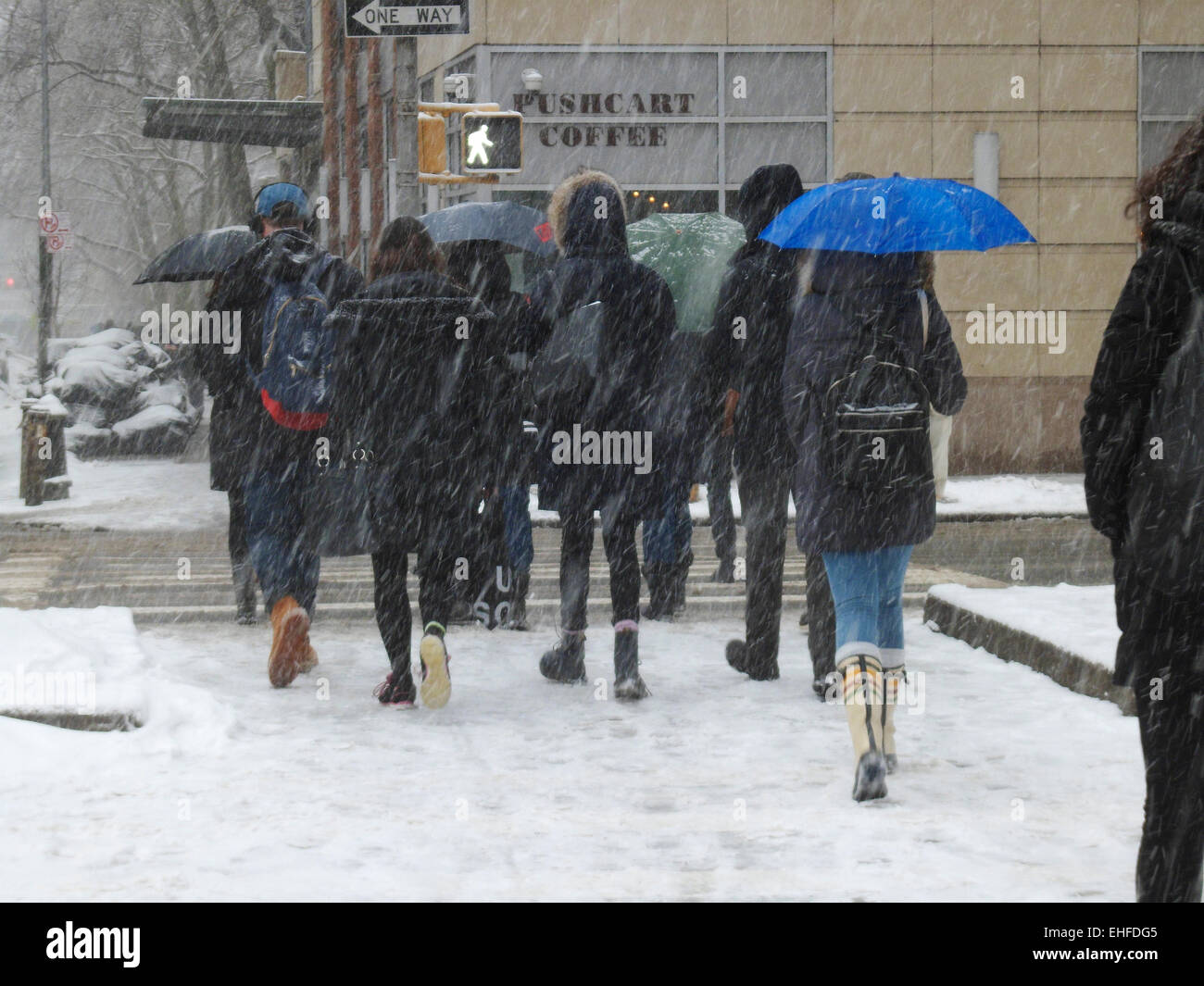 Pedestrians trudge through the snow on their way to work in the Chelsea ...
